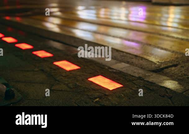 LED crosswalk lights embedded in pavement display red and green signals ...