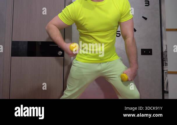 Pumping up the biceps and triceps of the arm with dumbbells. Workout at ...