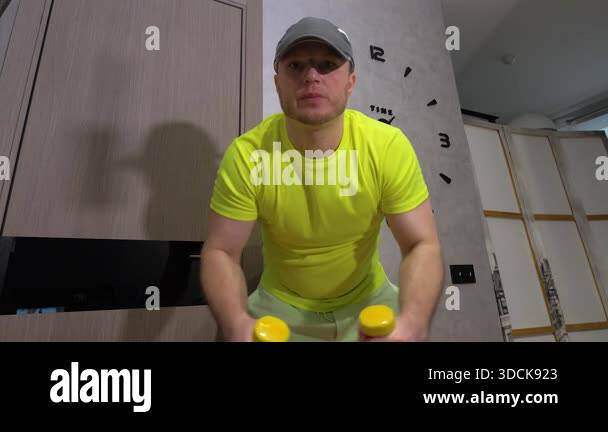 Training deltoid muscles, pumping up the shoulder joint of the arms ...