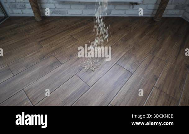 Oatmeal spills onto the floor in slow motion. Trash falls to the floor ...