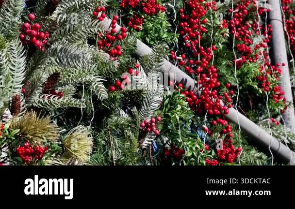 Christmas Decorations on Wall with Blurred Park and People in ...