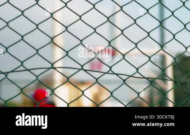 Two Young Boys Playing Basketball in an Open Field Sports Facility ...