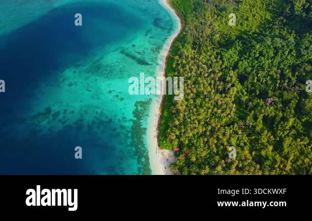 High drone shot showing part of Sikandang Island and surrounding sea as ...