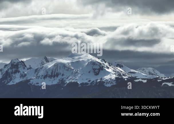 Aerial view cloudy sky over snow-capped Andes mountains in Coyhaique ...