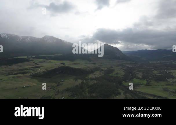 Aerial view cloudy sky over snow-capped Andes mountains in Coyhaique ...
