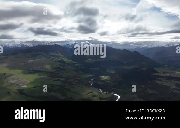 Aerial view cloudy sky over snow-capped Andes mountains in Coyhaique ...