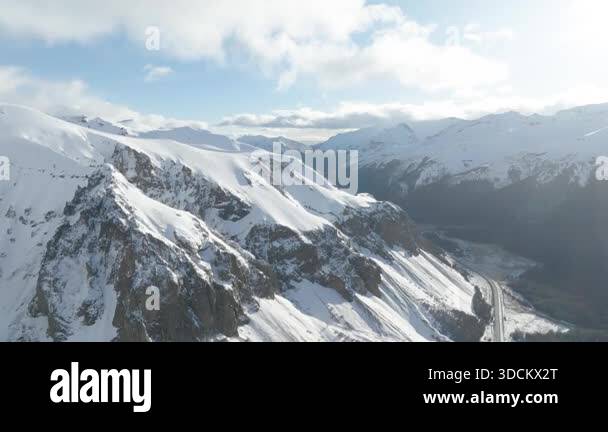 Aerial view cloudy sky over snow-capped Andes mountains in Coyhaique ...
