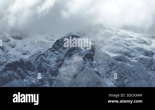 Aerial view cloudy sky over snow-capped Andes mountains in Coyhaique ...