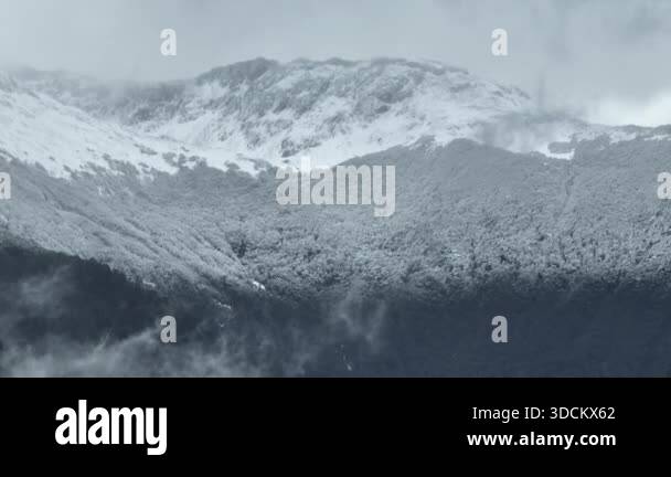 Aerial view cloudy sky over snow-capped Andes mountains in Coyhaique ...