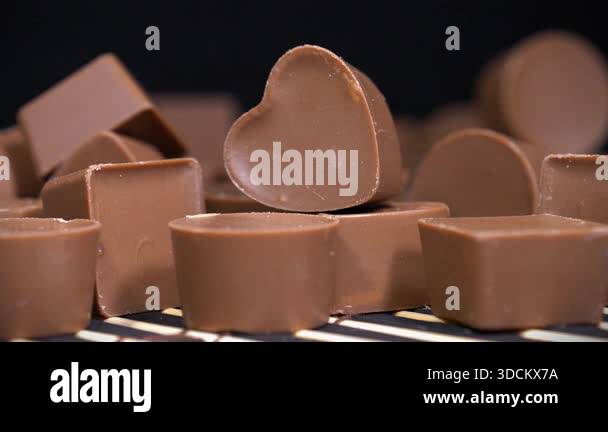 Delicious chocolate candy of different forms, including heart-shaped ...
