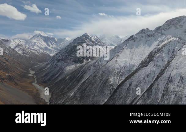 Majestic mountain landscape featuring snow-capped peaks and a winding ...
