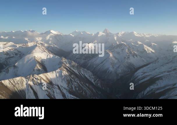 Snow-capped mountain range panorama showcases majestic peaks and ...