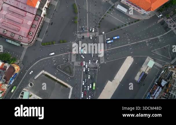 Top-down drone view of busy road intersection in Ho Chi Minh City ...