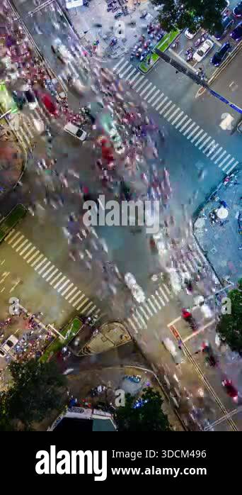 Top-down drone timelapse of busy urban intersection with cars ...
