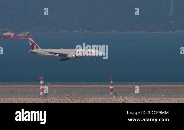 HONG KONG - JANUARY 28, 2025: Long-distance view of Qatar Cargo Boeing ...
