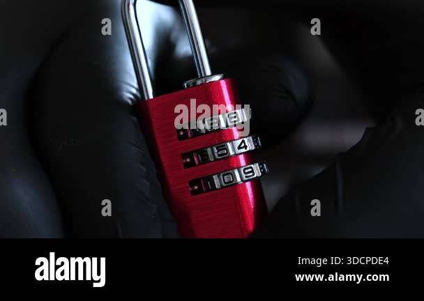 Person In Black Gloves Setting The Open Code On A Coding Lock For ...