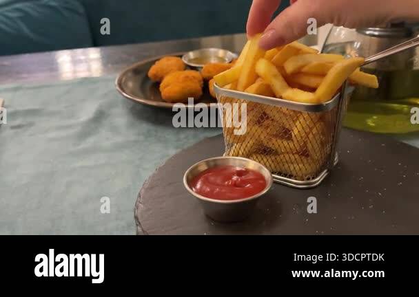 rotation golden crispy fried chicken nuggets fastfood and dipps. High ...