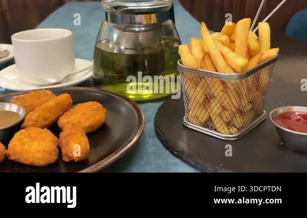 Kluang, Malaysia, 14 November 2024, French fries with chicken nuggets ...