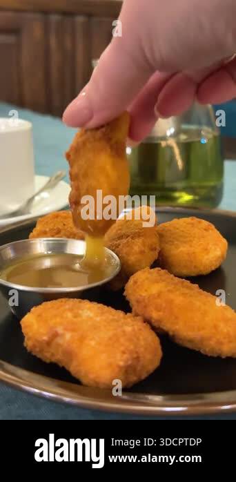 Curry cheese lemon sauce close up, fast food cafe Pouring fries potato ...