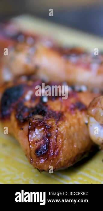 Whole chicken wings grill strung on a wooden stick grilling on the ...