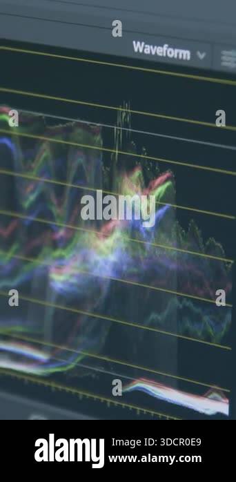 Color grading process unfolds on a computer screen, featuring waveform ...