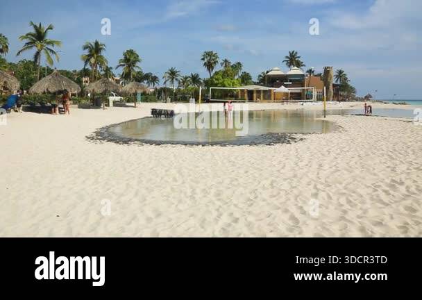 Beautiful view of stormy Caribbean Sea at Eagle Beach with volleyball ...