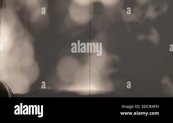 Abstract blurred sunlight dappling shadow overlay on wall Stock Video ...