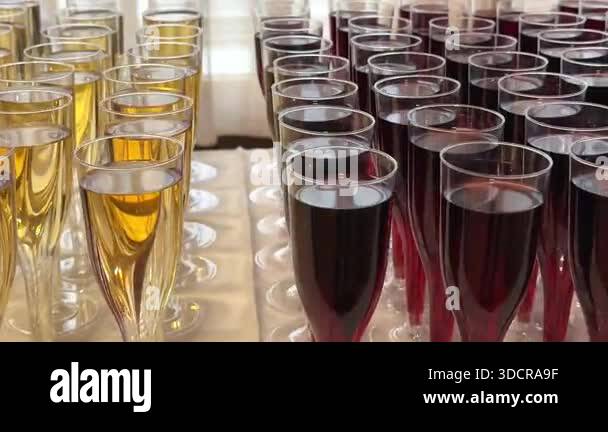 Two types of champagne at the buffet: red and white, many yellow ...
