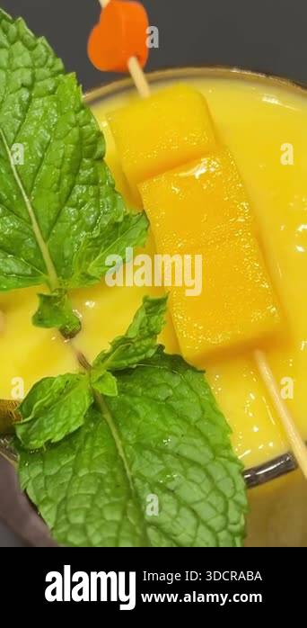 sweet and cool drink mango smoothie. High quality 4k footage Stock ...