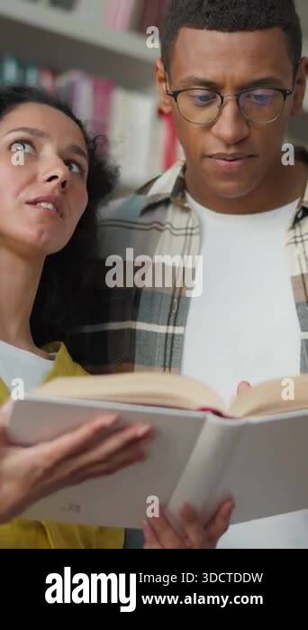 African American man Hispanic woman happy students reading book ...