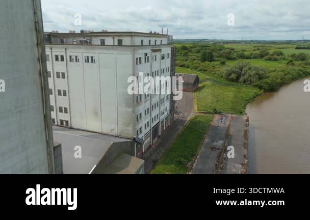 Aerial drone footage of industrial factories near the River Trent, with ...