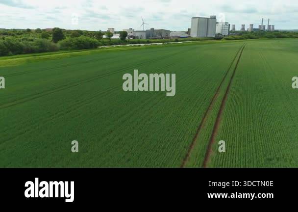 Aerial drone footage of industrial factories near the River Trent, with ...
