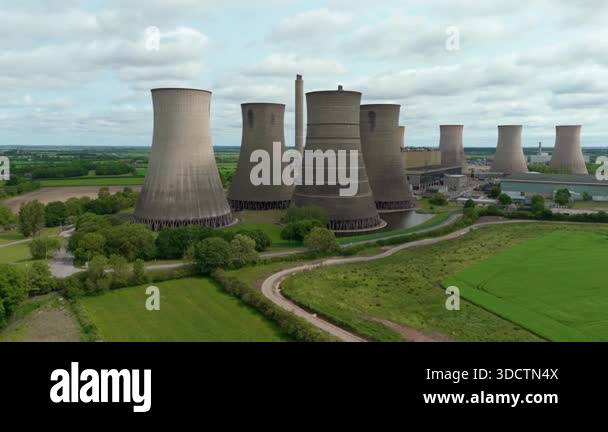 Aerial view of large power plant, cooling towers and chimney stacks in ...