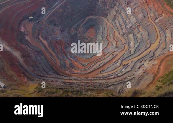 Aerial drone perspective of huge quarry, open pit mine, gravel and rare ...