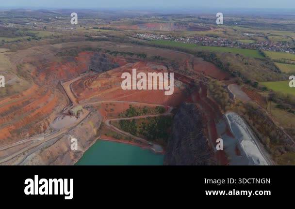 Aerial drone perspective of huge quarry, open pit mine, gravel and rare ...