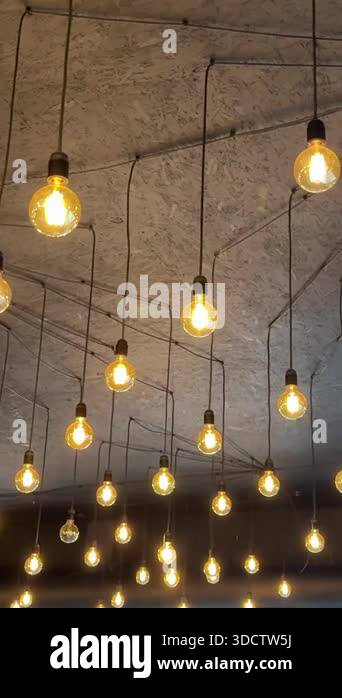 hanging on small bulbs in loft style home decor restaurant premises ...