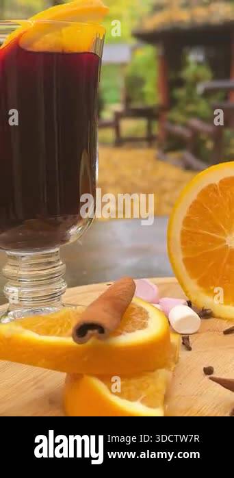 hot alcoholic mulled wine stands on a board outside in autumn good ...