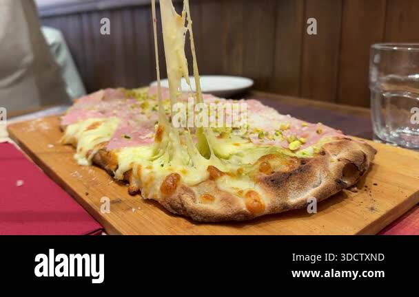 Appetizing Cheesy Italian Pizza with Ham, Cheese and Pistachios, Woman ...