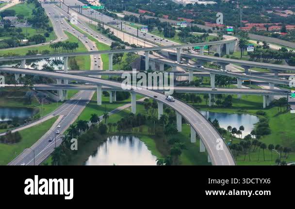 Aerial view of American freeway intersection with fast driving cars and ...