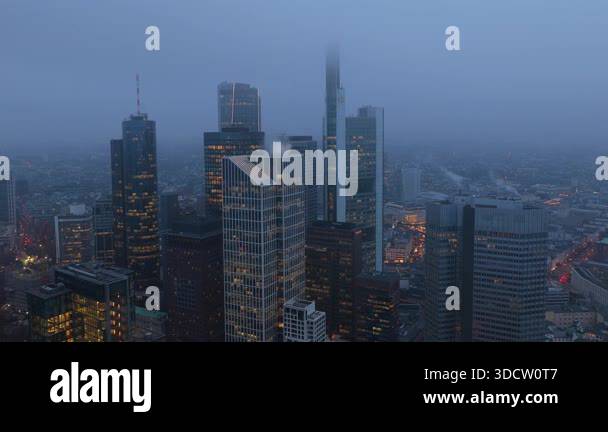 Aerial view of Frankfurts financial district at dusk, featuring ...