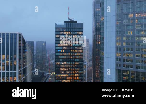 Business people working late in Omniturm modern skyscraper office ...