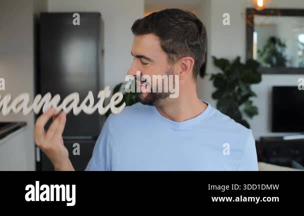 Man holding sign that says Namaste indoors Stock Video Footage - Alamy