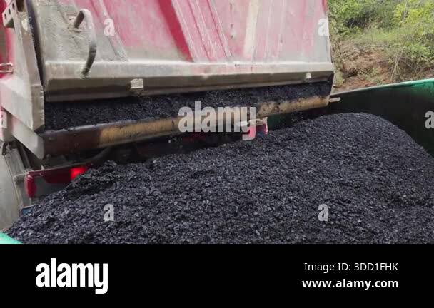Road construction. Asphalt pavement machine making new layer of asphalt ...