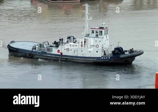 Buenos Aires, Argentina - March 20, 2015: Tugboat Controlling Cargo ...