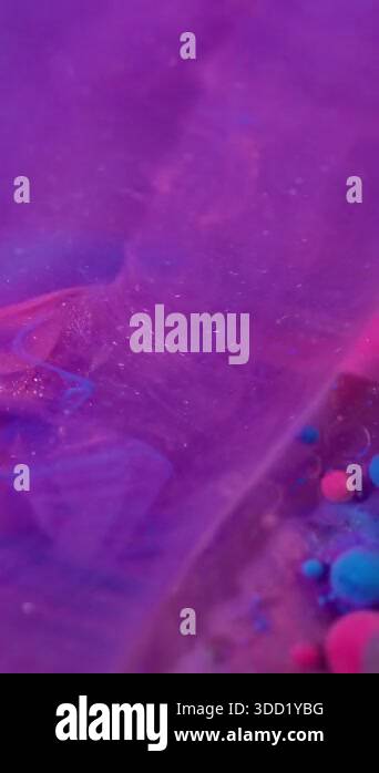 Vertical video. Drop emulsion. Oil paint bubble. Colorful gel ball flow ...