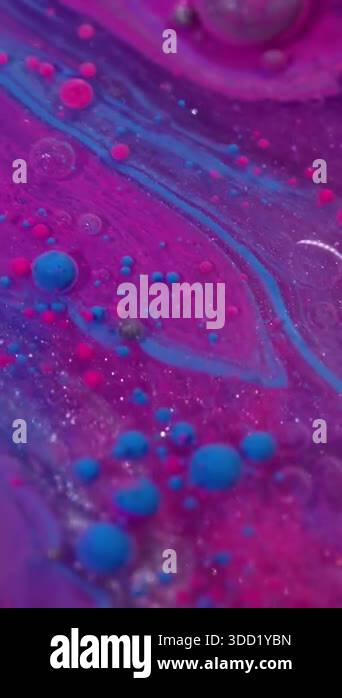 Vertical video. Paint substance. Acrylic blob. Purple blue mix oil ...