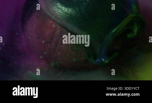 Dripping glitter. Defocused art splash. Shimmering ink green flow ...