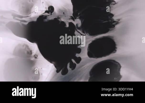 Ink blotch. Pigment spill. Defocused black white color spatter liquid ...