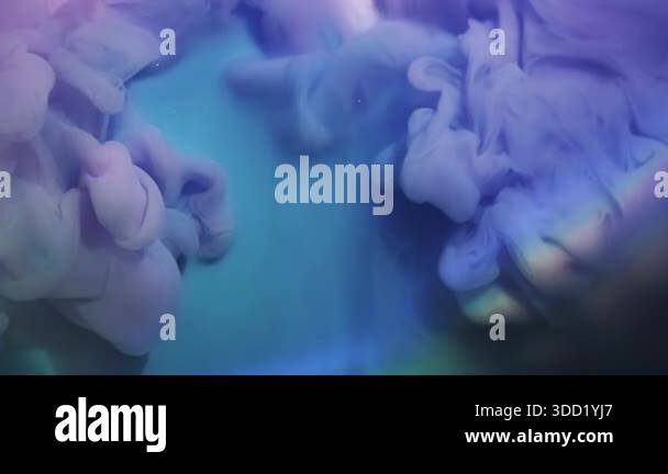 Fluid paint mix. Ink background. Defocused purple blue white color ...