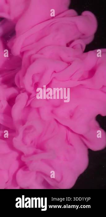 Vertical video. Smoke stream. Dye spread. Bright color pink paint ...